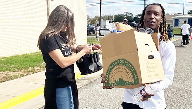 Boxing Champ “Shock” Foster leads team to knockout Thanksgiving hunger ...